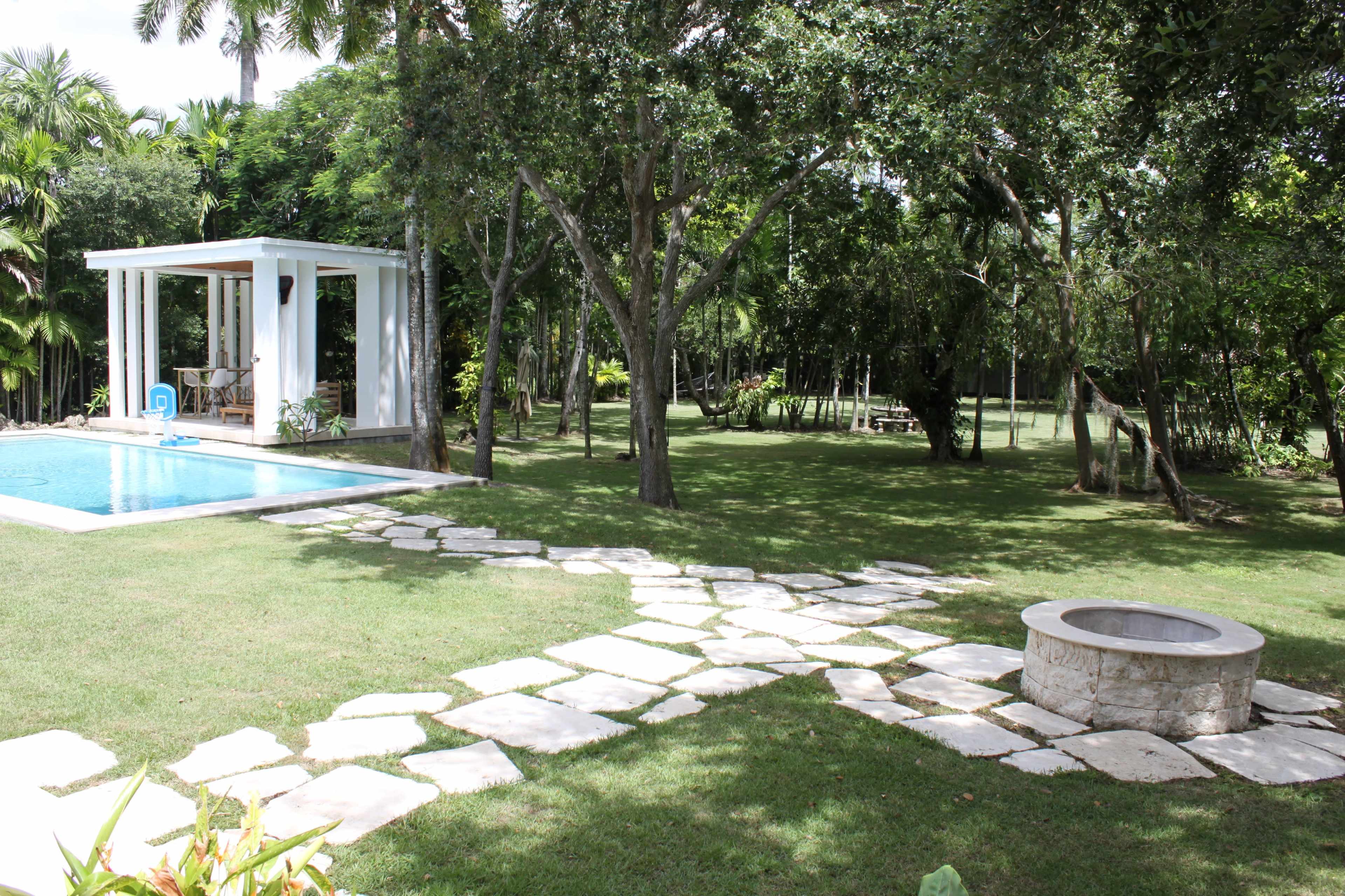 Modern Tropical Estate with Lush Tropical Landscape, Pool, and Cabana ...