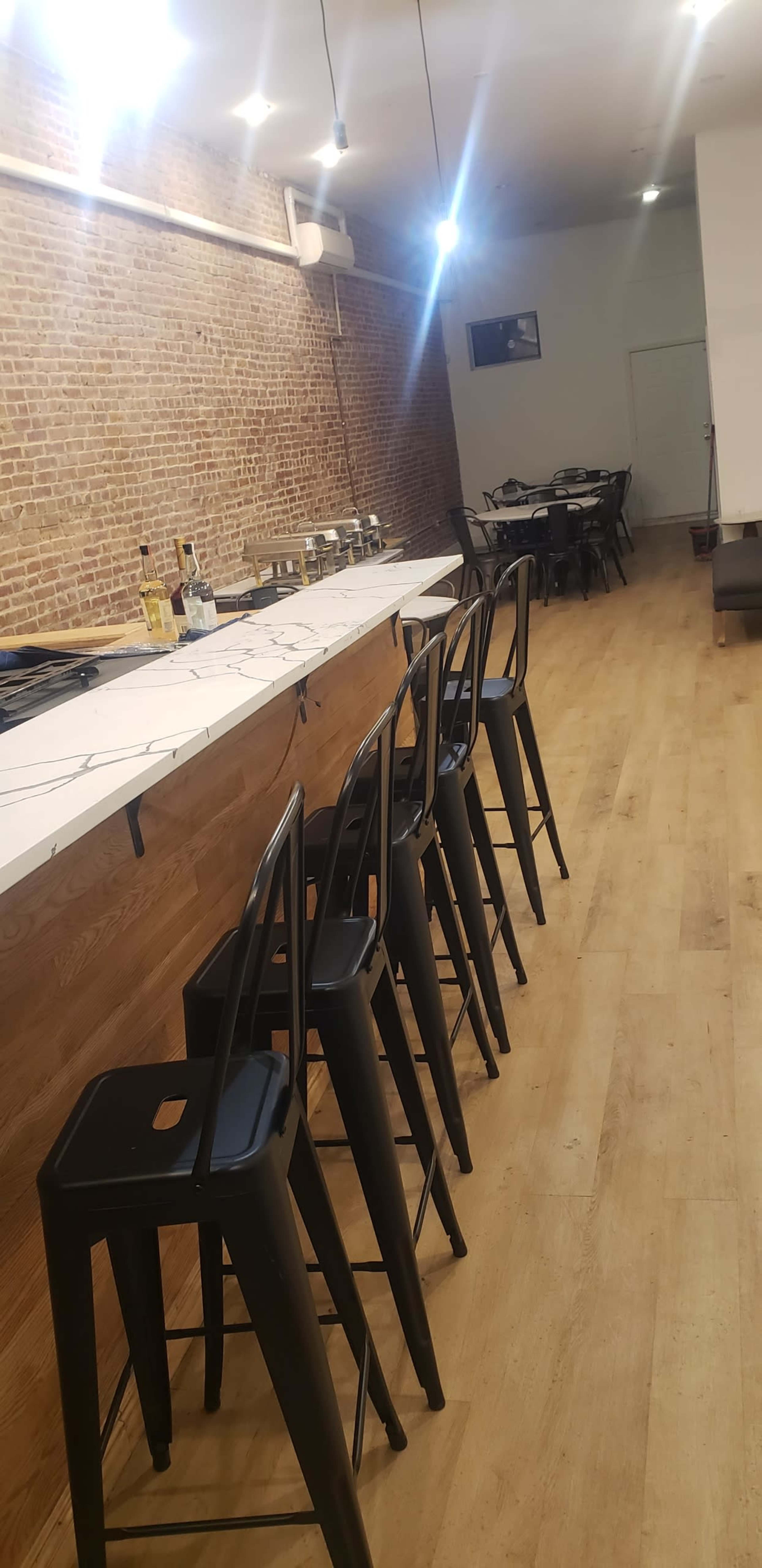 Urban lofty space with high ceilings includes an outdoor patio and ...