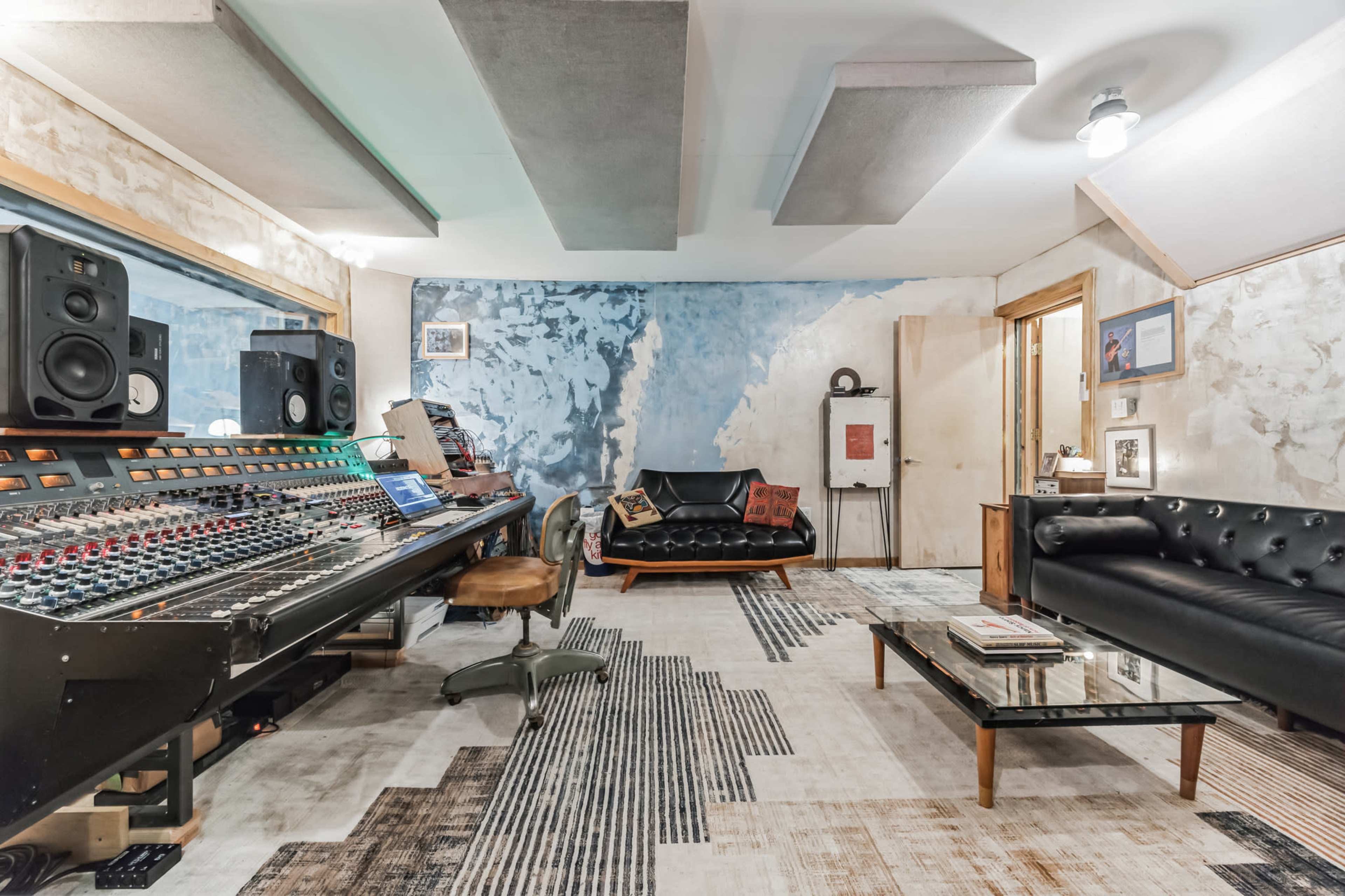 Spacious elegant recording studio with natural light and a refined ...