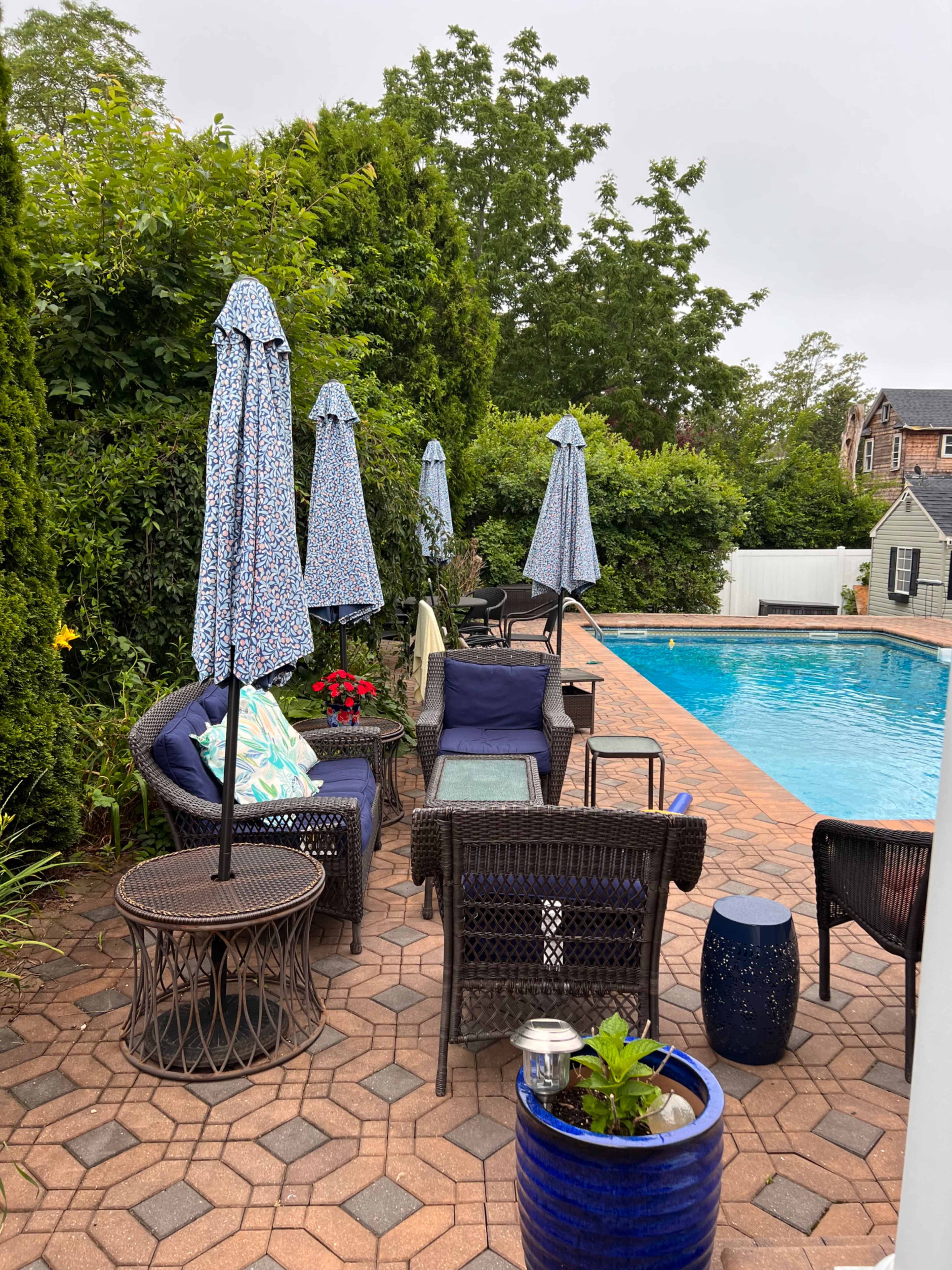 Relaxing poolside and barbecue. Pool house for food or play area for ...