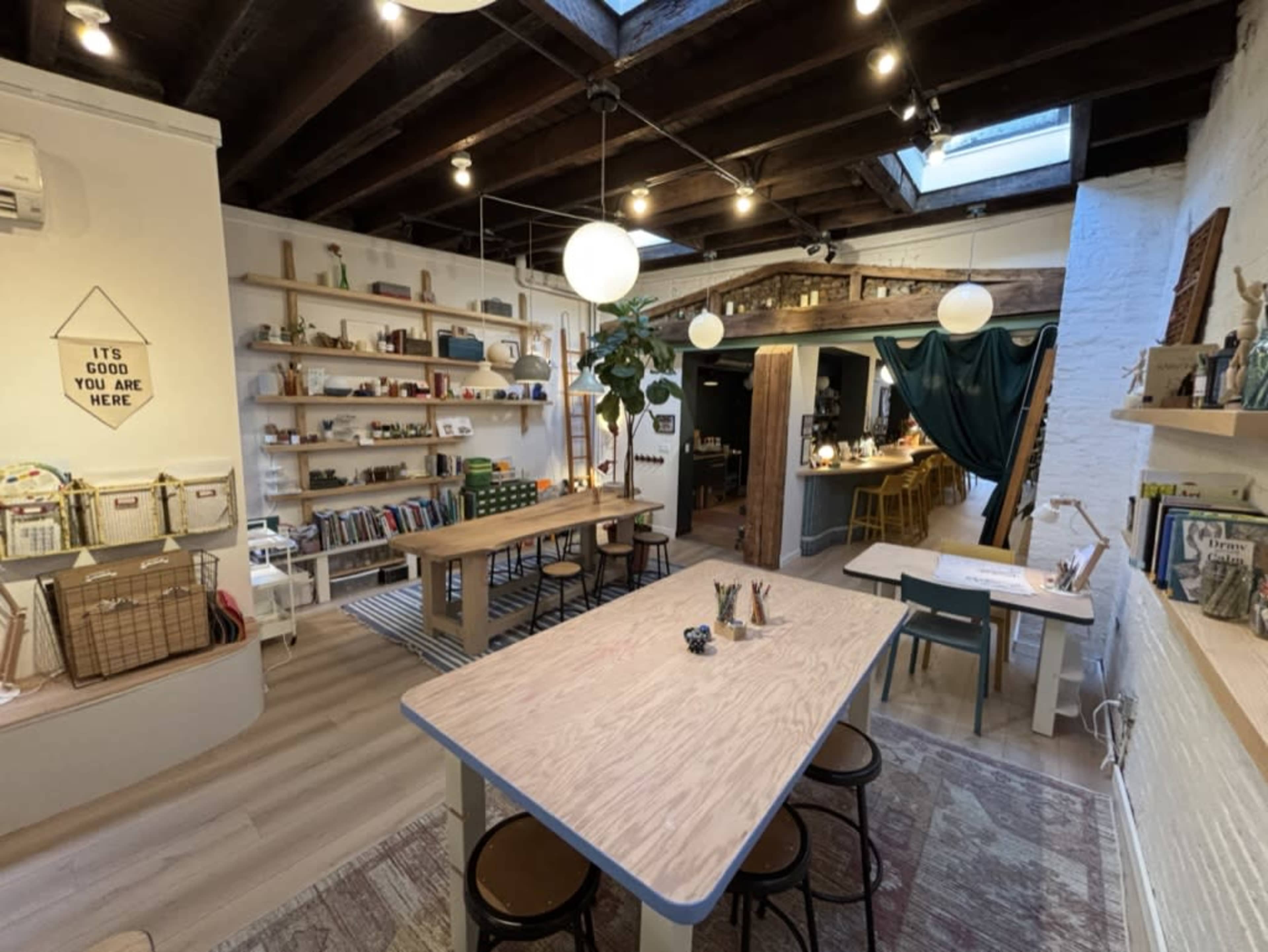 sky lit multi-use space with hand-crafted decor and plants galore ...