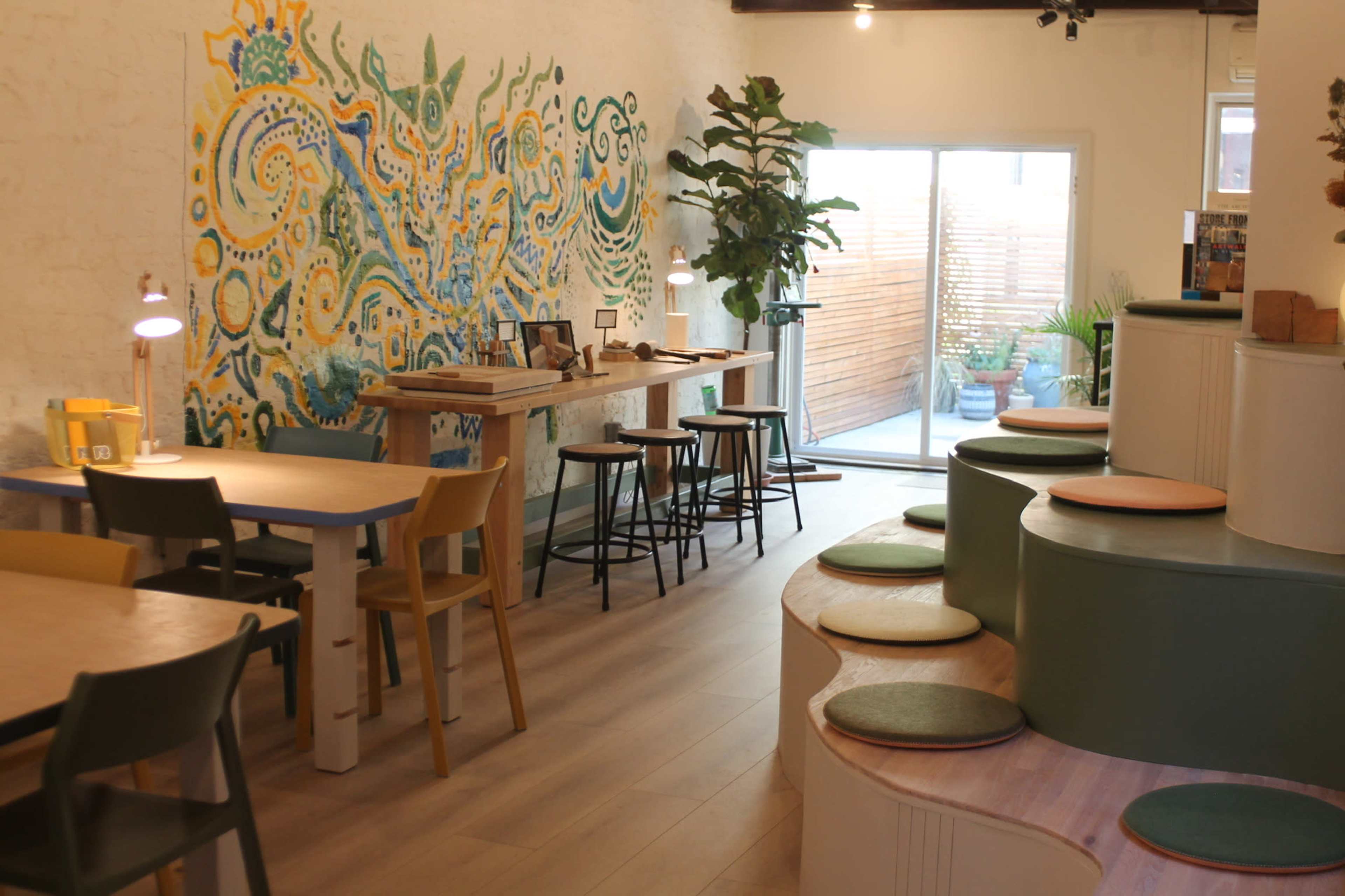 sky lit multi-use space with hand-crafted decor and plants galore ...