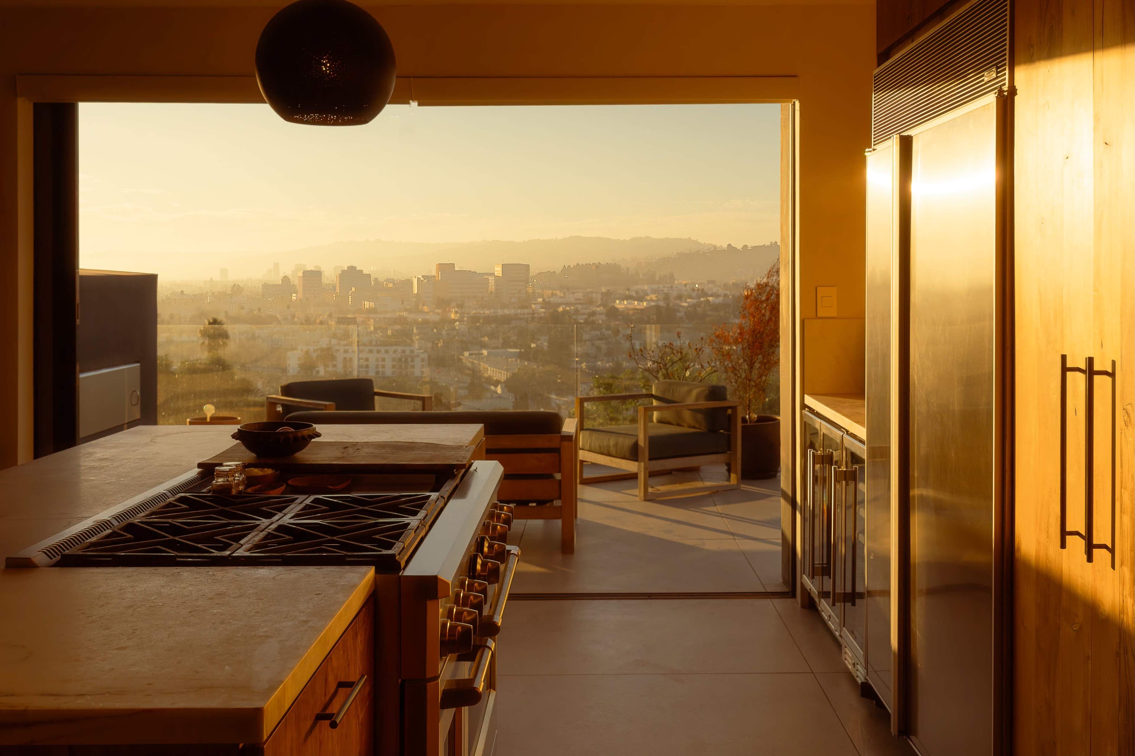 Hip view home. 30’ of bookshelves and open chef’s kitchen w/ stove in ...