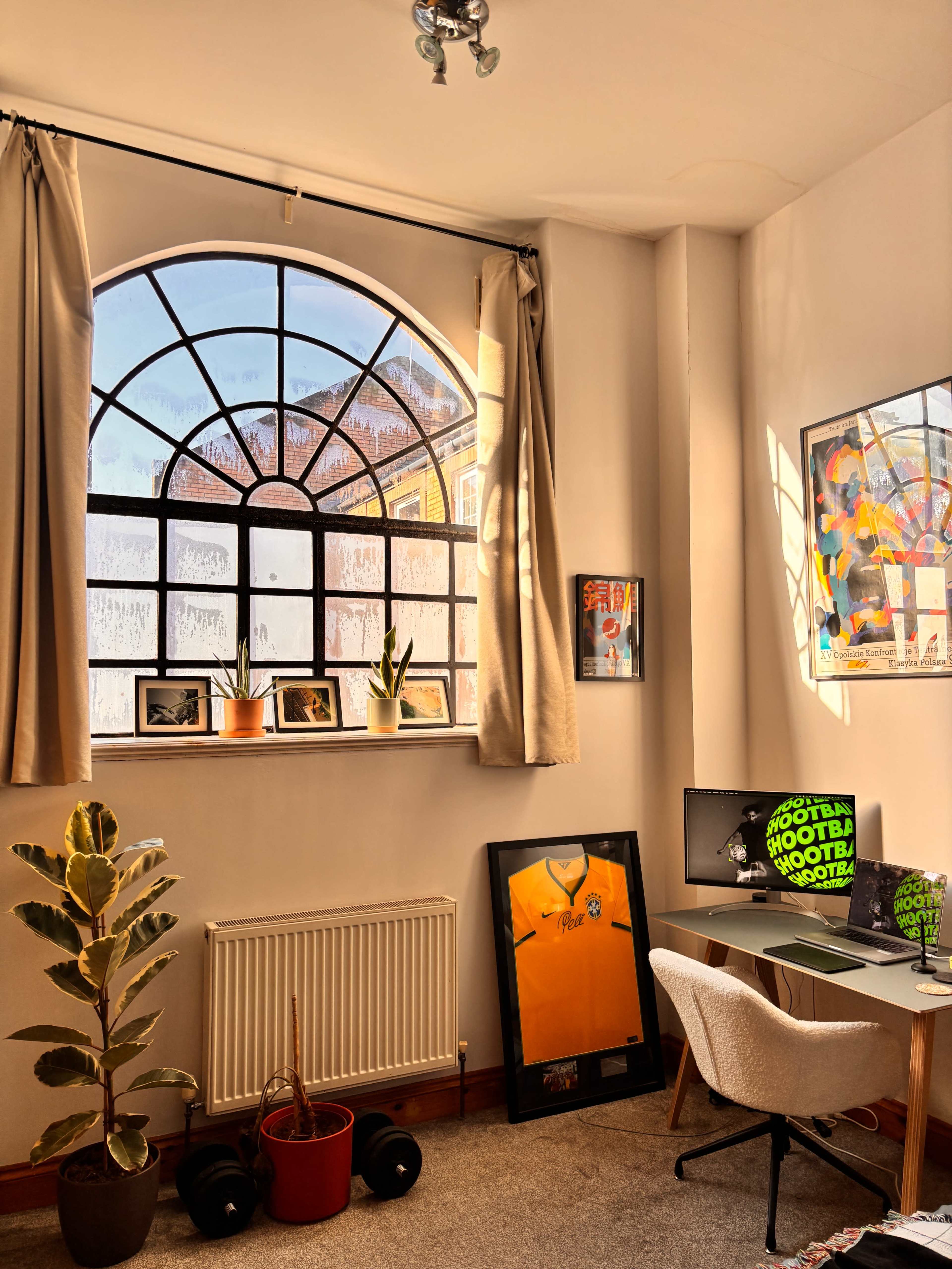 Converted factory apartment with high ceilings & archway windows ...