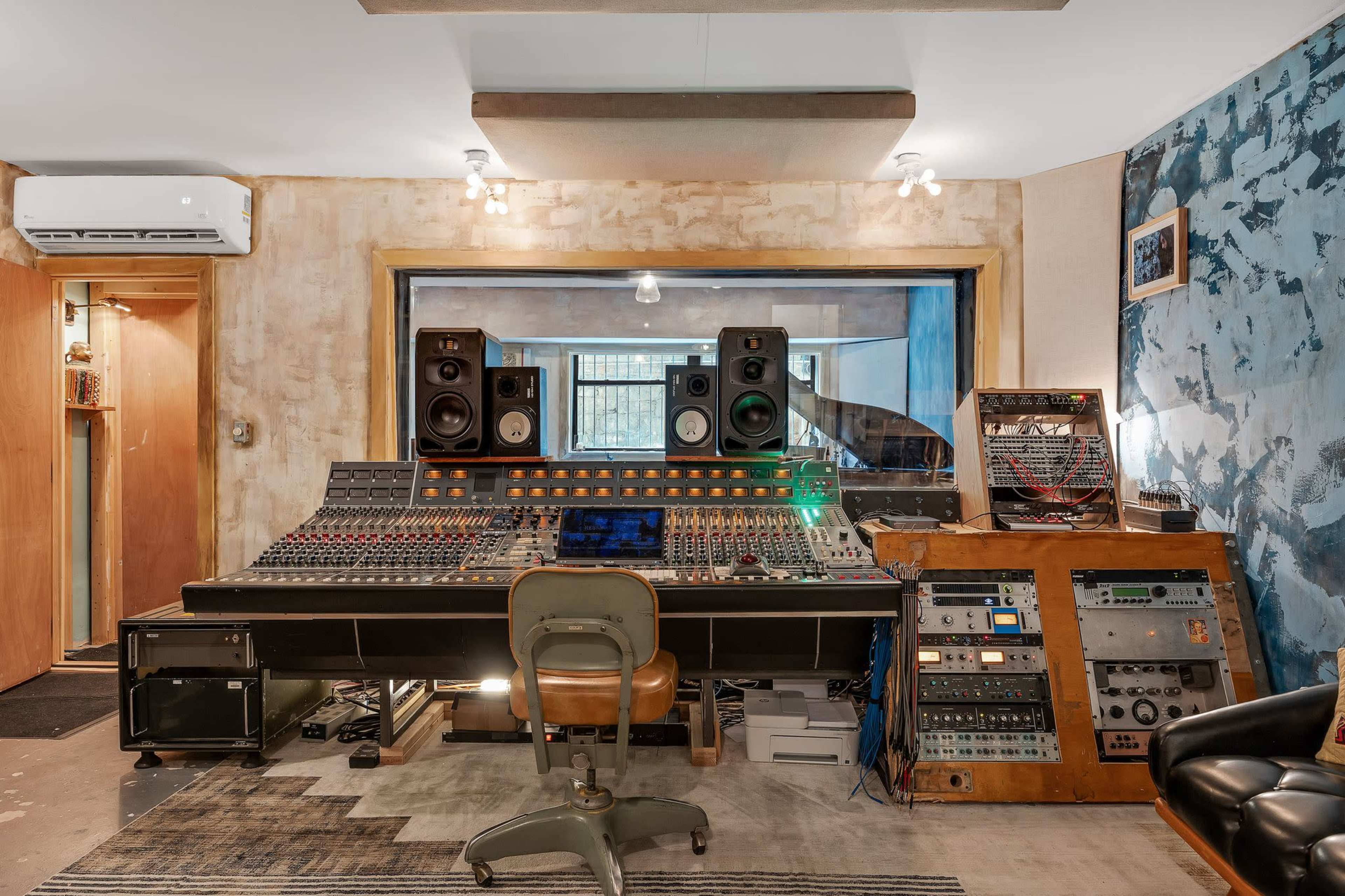 Spacious elegant recording studio with natural light and a refined ...