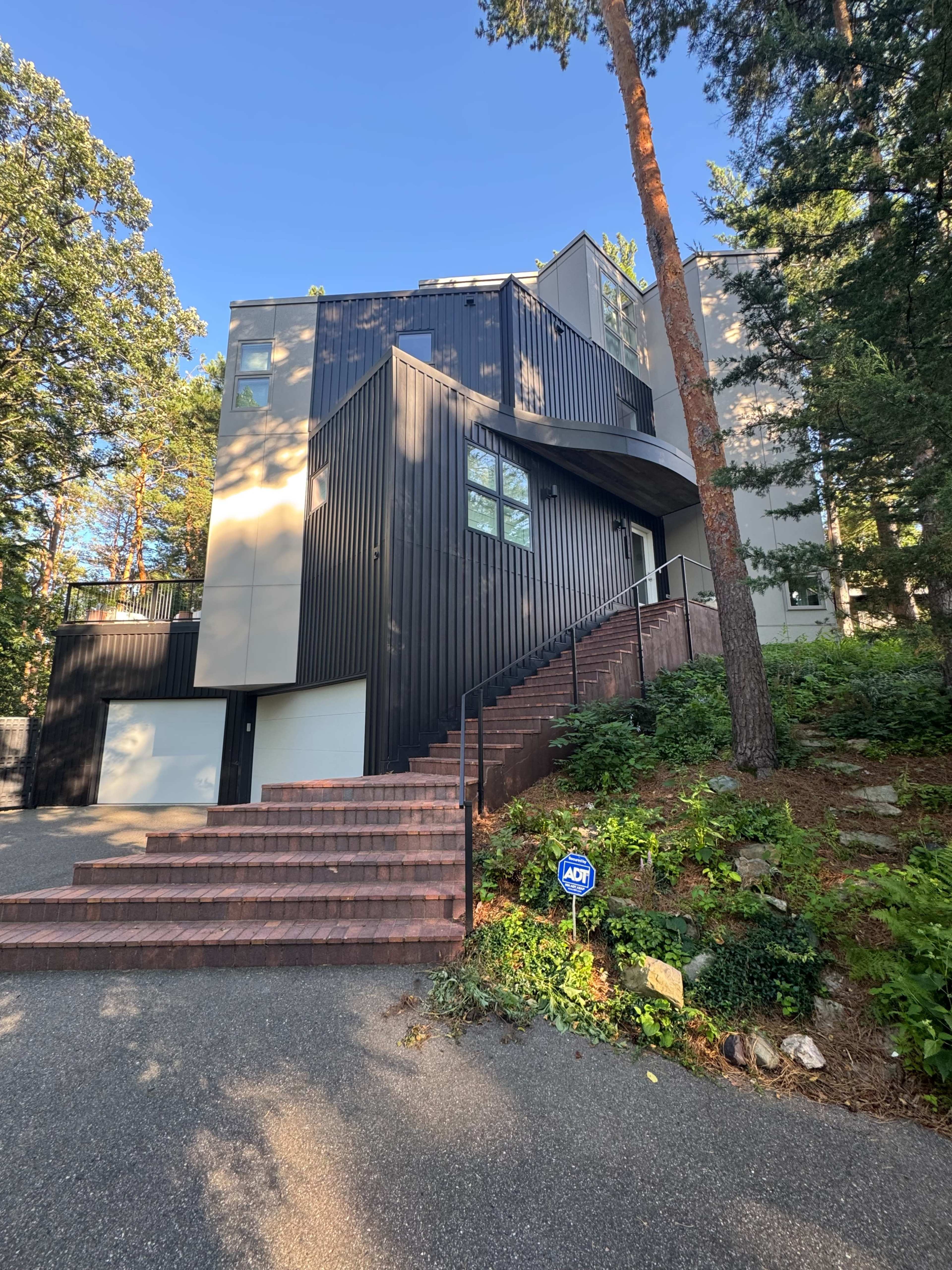 Architect-Designed Modern Home with 3-Story Atrium & Wooded Views ...