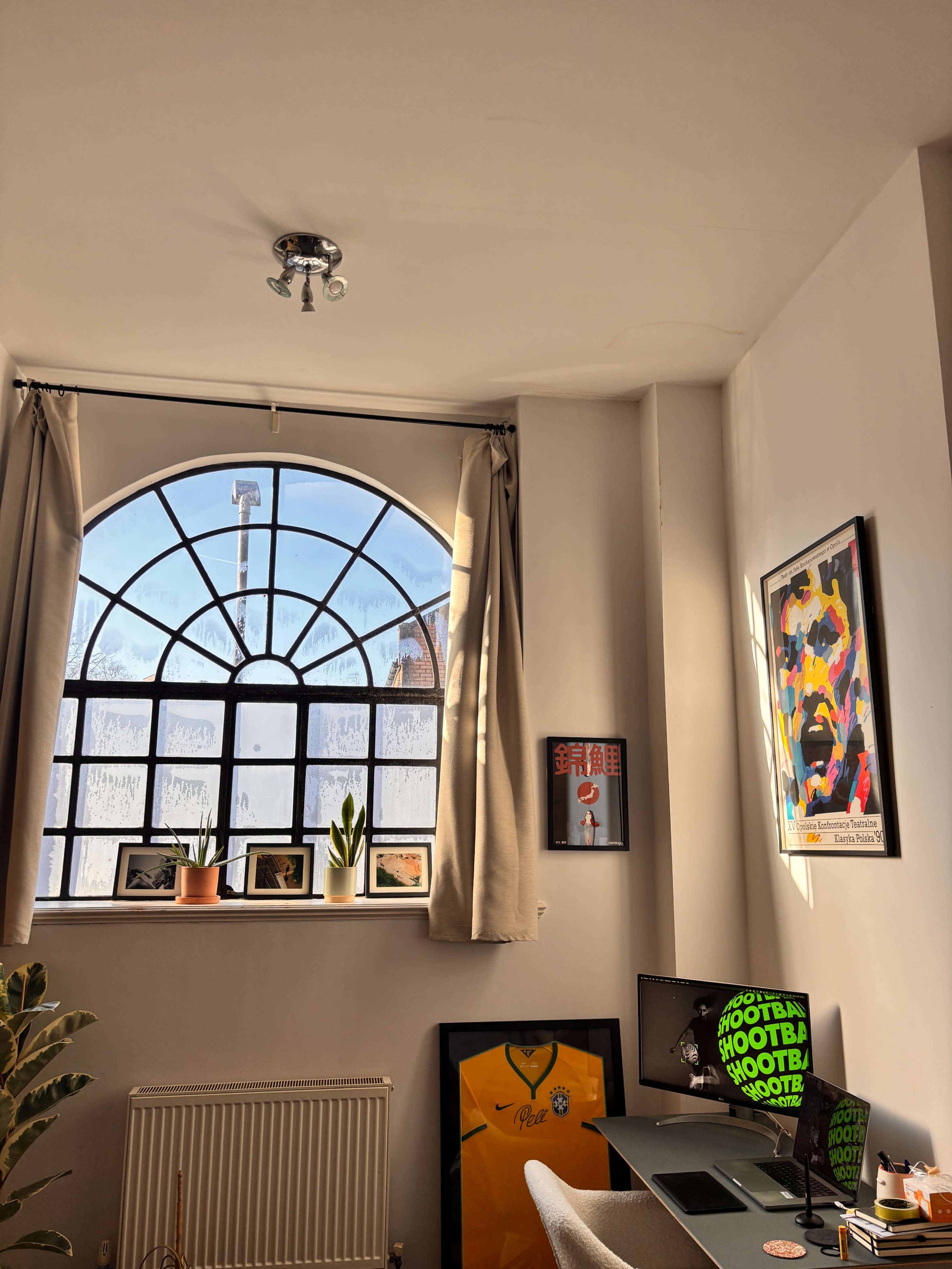 Converted factory apartment with high ceilings & archway windows ...
