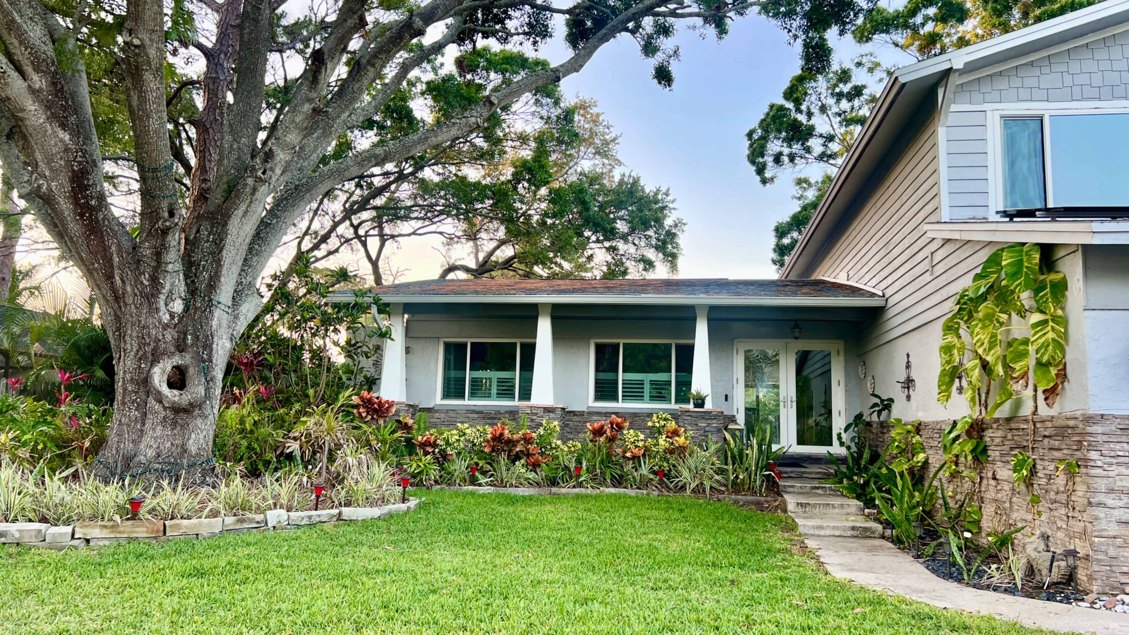 Front porch style bungalow on a small pond, clearwater, FL | Production ...